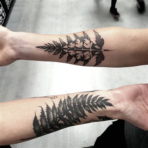 Matching Fern Leaf Tattoos On The Arms Piotr Bemben From Krakow