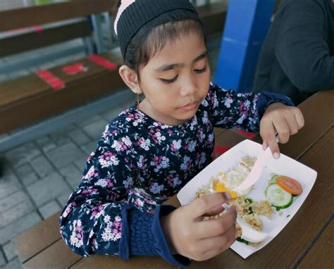Premium Photo High Angle View Of Cute Girl Holding Food