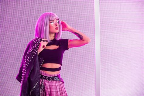 Premium Photo Pretty Girl With Stylish Clothes Posing Near Led Lights
