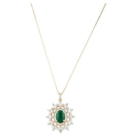 14k Yellow Gold Pendant Necklace Featuring 927ct Emerald Sapphire And