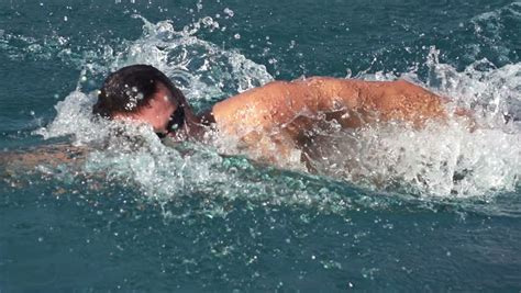 Woman In Blue Bathing Suit Swimming Underwater In Slow Motion Stock