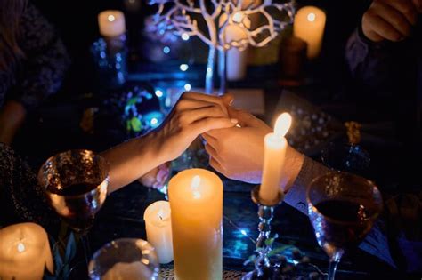 Premium Photo Midsection Of Woman Holding Lit Candle