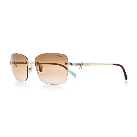 Tiffany Twist Rimless Square Sunglasses In Pale Gold Coloured Metal
