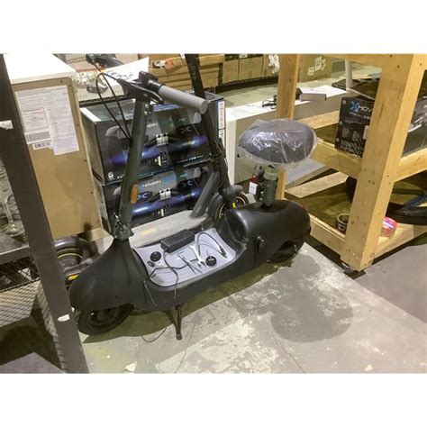 Okai Electric Scooter With Charger In Need Of Repairs