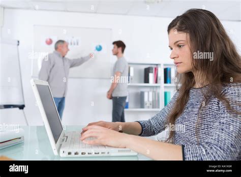 Babe Taking Notes With Laptop In Class In University Stock Photo Alamy