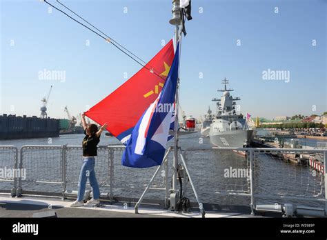 Chinese Visitor Holding Flags Of China On The Guided Missile Destroyer