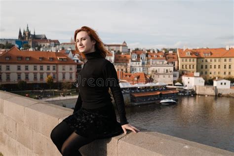 Happy Redhead Tourist Traveler In Prague Czech Republic Wearing Black
