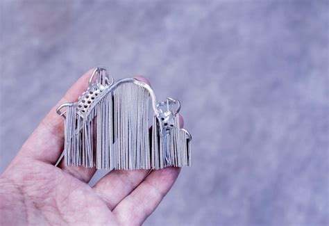 Premium Photo Man Is Holding Object Printed On Metal 3d Printer