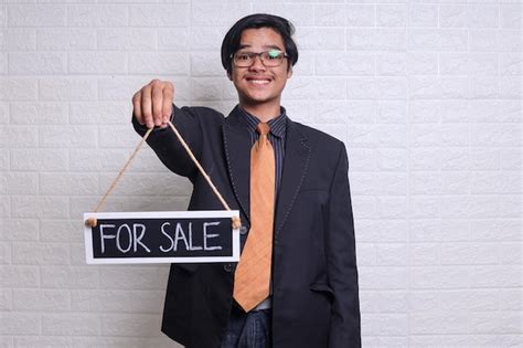 Premium Photo Happy Young Asian Salesman Holding Black Board With