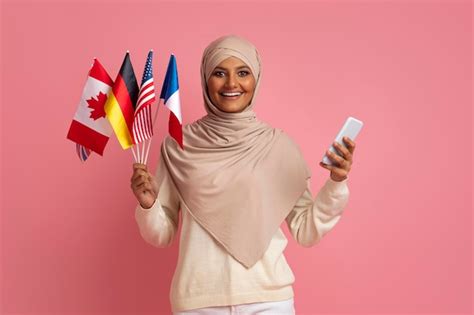 Premium Photo Online Translator App Smiling Muslim Woman Holding