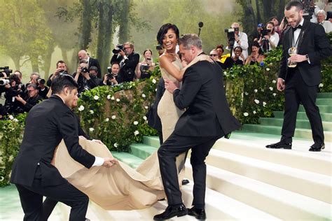 Tyla Gets Carried Up The 2024 Met Gala Steps In Her Balmain Sand Dress