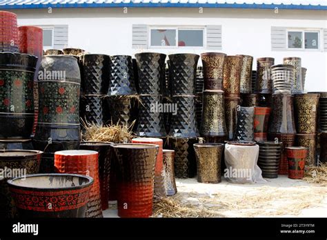 Flowerpot And Flower Gardening Tools Stacked Together In A Shop Stock