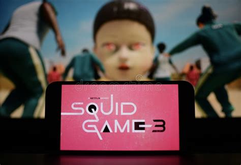 Squid Game 3 Ojingeo Geim Logo Displayed On Smartphone Screen This
