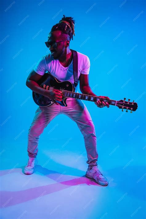 Free Photo Young African American Musician Playing The Guitar Like A