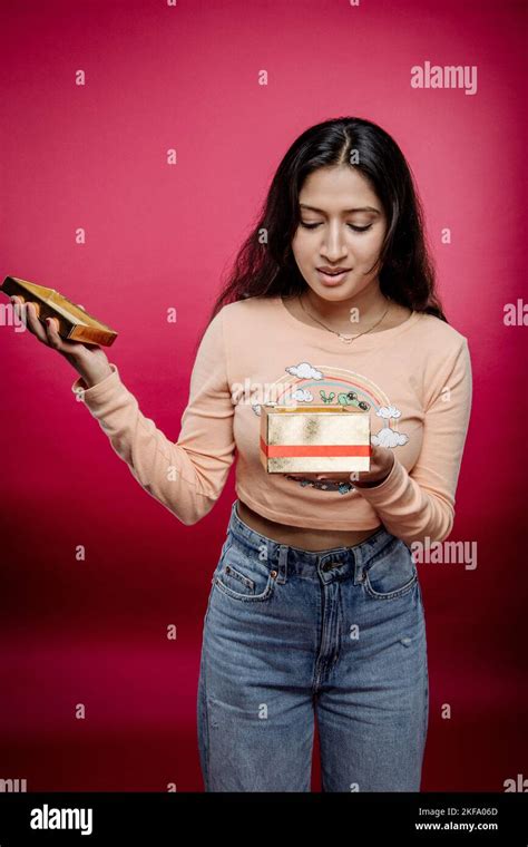 Surprised And Joyful Young Woman Receives The T From Belove And