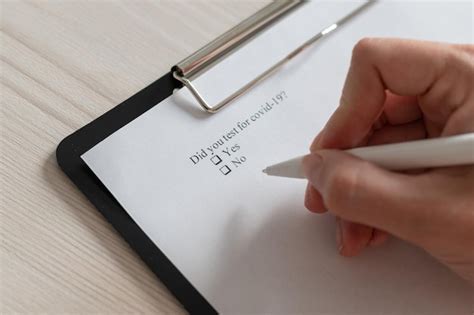 Premium Photo Unrecognizable Woman Puts A Daw In The Questionnaire A Closeup Of A Female Hand