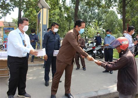 H E Khuong Sreng Distributes Facemasks To Passengers In Phnom Penh