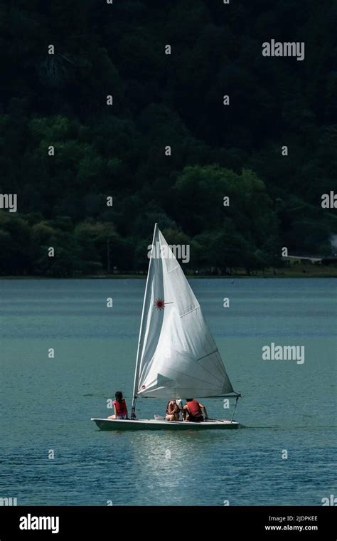 Small Sail Boat In The Furnas Lake Lagoa Das Furnas With Green Vegetation In The