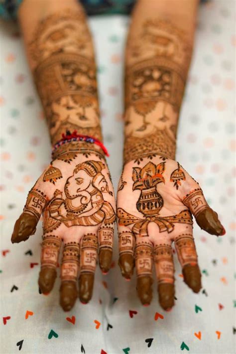 Ledy Feet And Hands In Heena For Wedding In Orange And Red Background