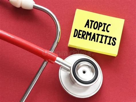 The Words Atopic Dermatitis On The Little Yellow Piece Of Paper Next To
