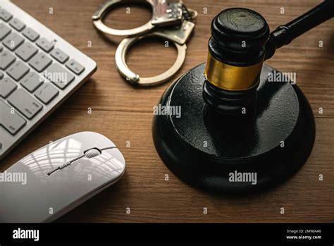 Concept Of Internet Crime With Gavel Computer Keyboard Mouse And