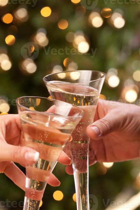 Man And Woman Toasting Champagne In Front Of Lights 16355305 Stock