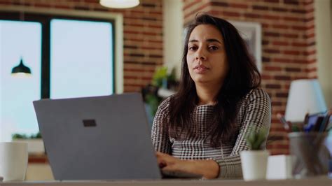 Portrait Of Cheerful Freelancer Checking Her Emails On Notebook Device