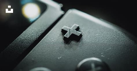 Black And Gray Game Controller Photo Free Grey Image On Unsplash