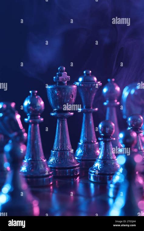 Chess Pieces On Checkerboard In Color Light Selective Focus Stock