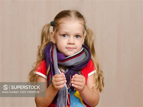 The Three Year Girl With Diseased Scarf Holding A Certain Object