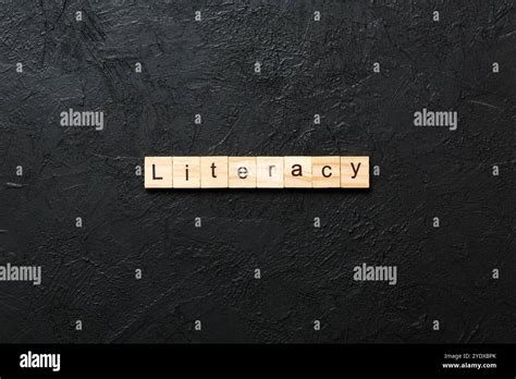 Literacy Word Written On Wood Block Literacy Text On Cement Table For Your Desing Concept