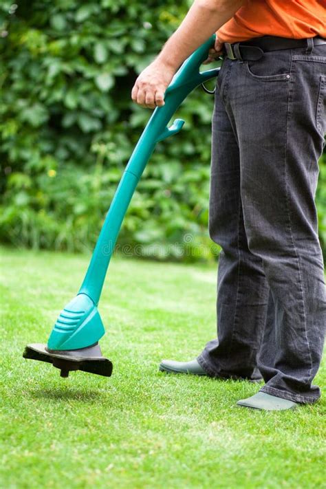Man Mowing Lawn With Grass Trimmer Stock Image Image Of Nature Hedge