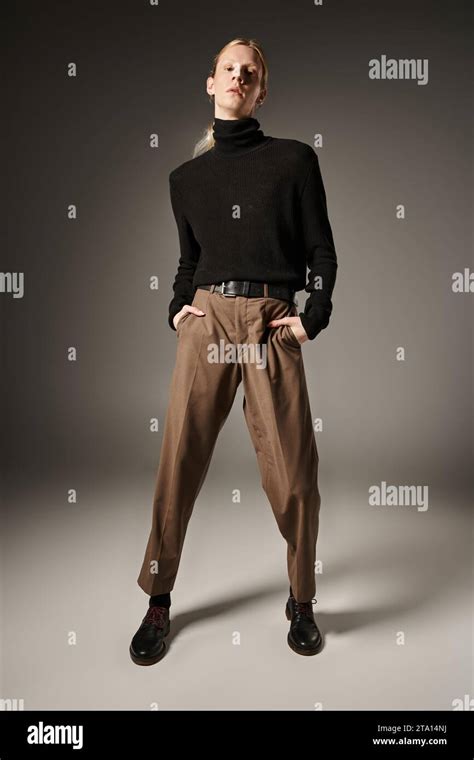 Young Non Binary Person In Stylish Attire Posing With Hands In Pockets