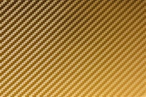 Premium Photo Gold Carbon Fiber Composite Raw Material Background
