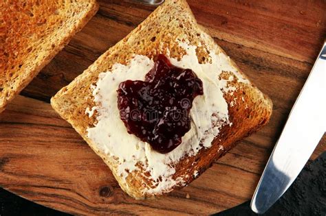 Toast Bread With Homemade Strawberry Jam And Apricot Marmalade On