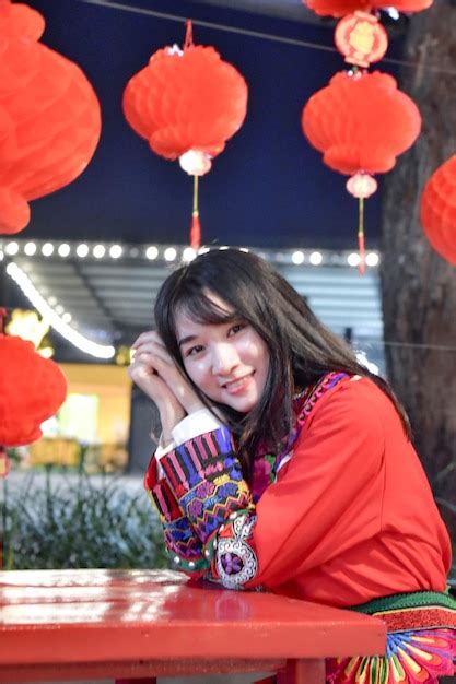 Premium Photo Portrait Of Smiling Girl Sitting Outdoors