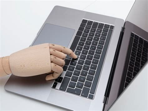 Premium Photo Wooden Hand Touching Computer Keyboard