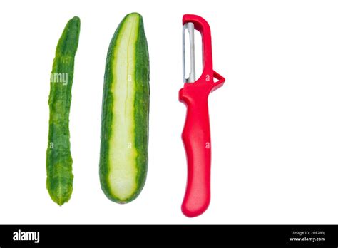 Cucumber Cucumber Peel And Peeler Knife On White Isolated Background