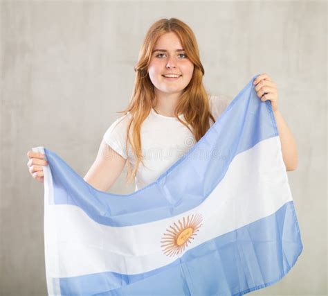 Portrait Of Happy Girl Of Argentina Match Waving National Flag Stock