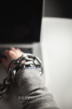 Man Bound In Chains And On A Laptop Stock Photos Pearl