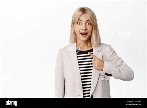 Portrait Of Corporate Office Girl Looking Surprised Pointing Finger At Herself Winning