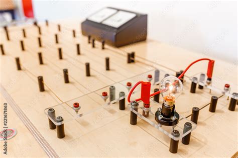school experiment with electric circuit and a light bulb physics
