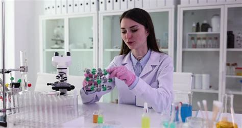 Young Woman Holds Molecular Model Explaining Structure In Lab Stock