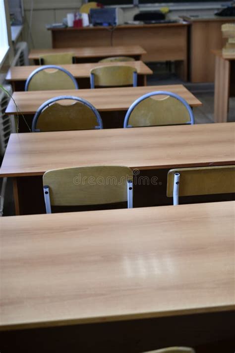 School Supplies Education Concept School Desks And Chairs In A