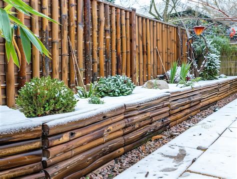Winter Gardening Bamboo Fence Screening And Railway Sleeper Planters In