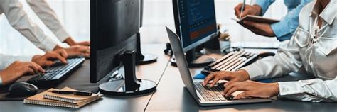 Premium Photo Software Development Team Working Together In Office Coding Script Display On