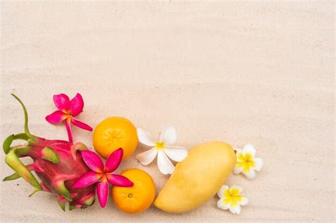 Premium Photo Mango And Dragon Fruit On Sand Beach