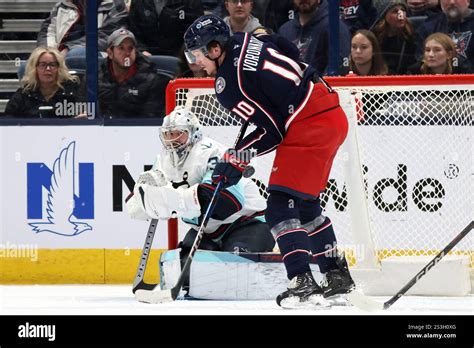Seattle Kraken Goalie Philipp Grubauer Left Makes A Stop In Front Of