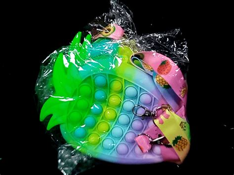 Assortment Of 8 Push Pop Fidget Toys Dutch Goat