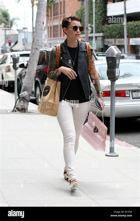 Ruby Rose Wearing White Skinny Jeans And A Leather Jacket At Anastasia